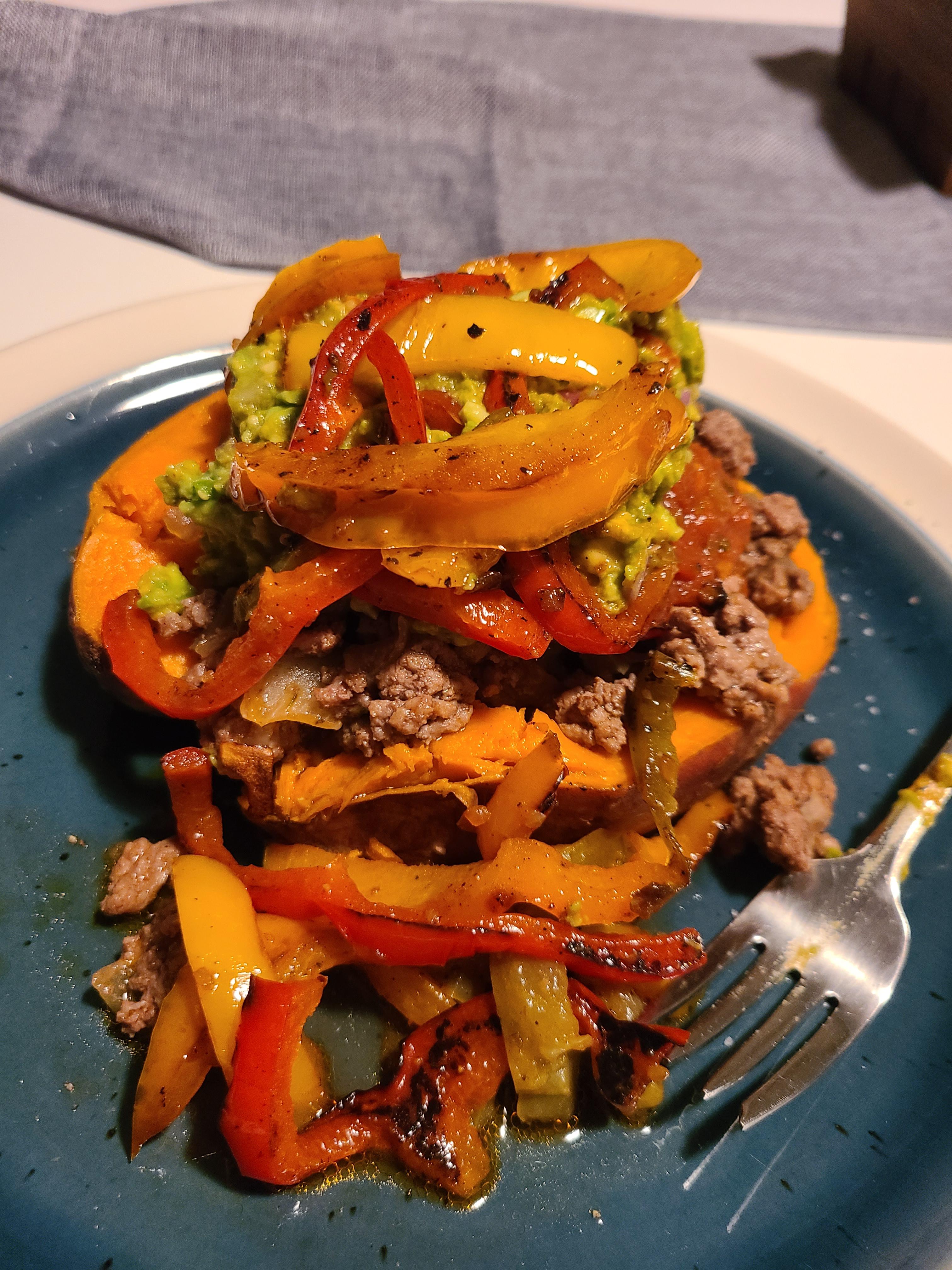 Taco potato! Sweet potato, ground beef, guacamole, roasted peppers and salsa | Scrolller