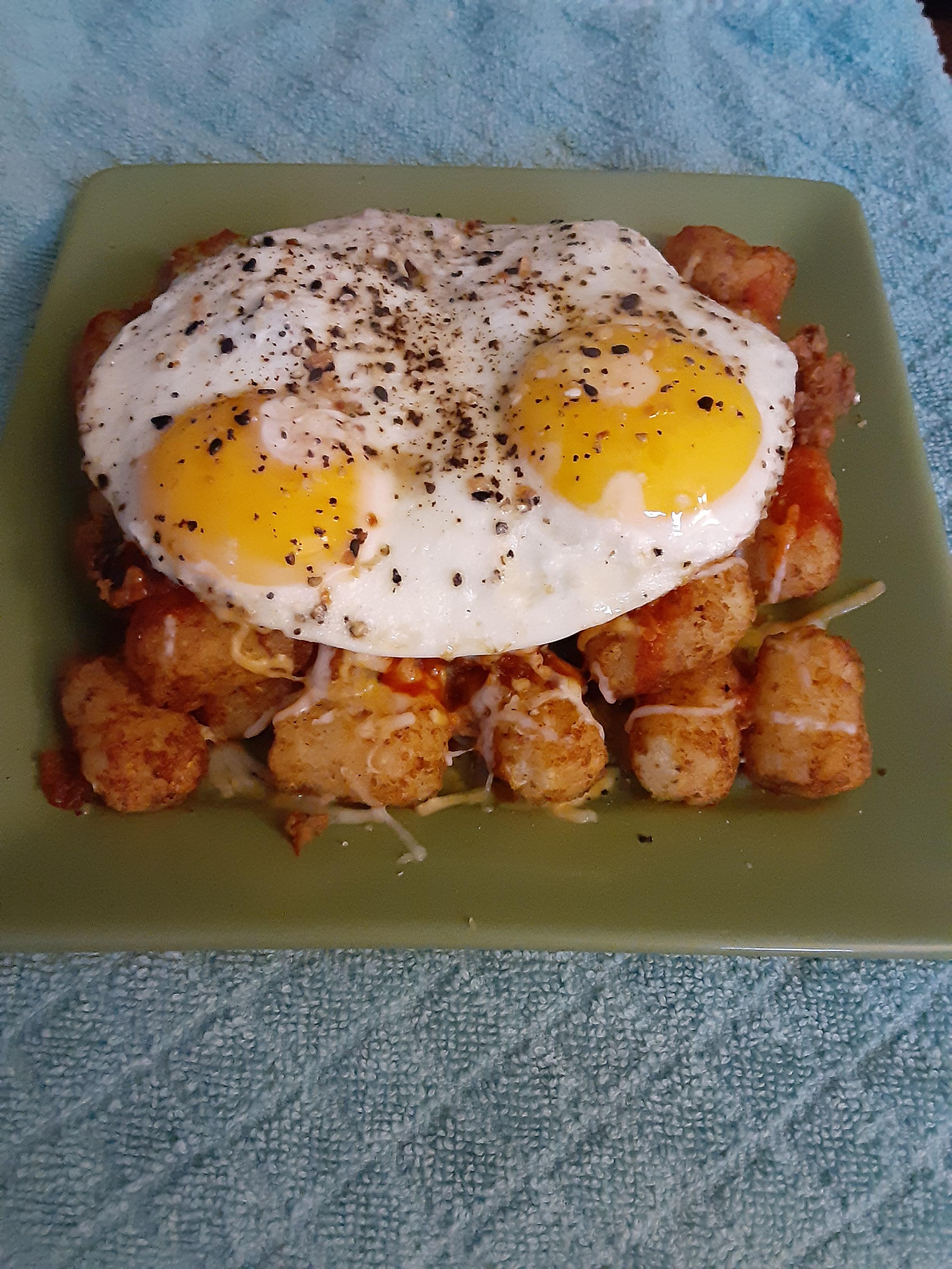 Tater tots with homemade chili fried eggs | Scrolller