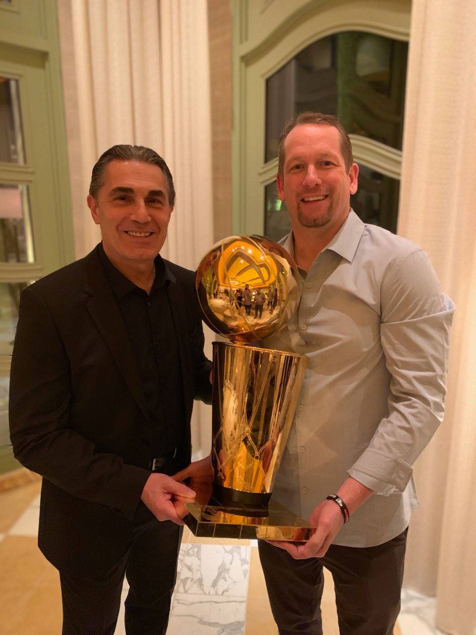 The great Nick Nurse and his assistant Sergio Scariolo with the trophy. | Scrolller