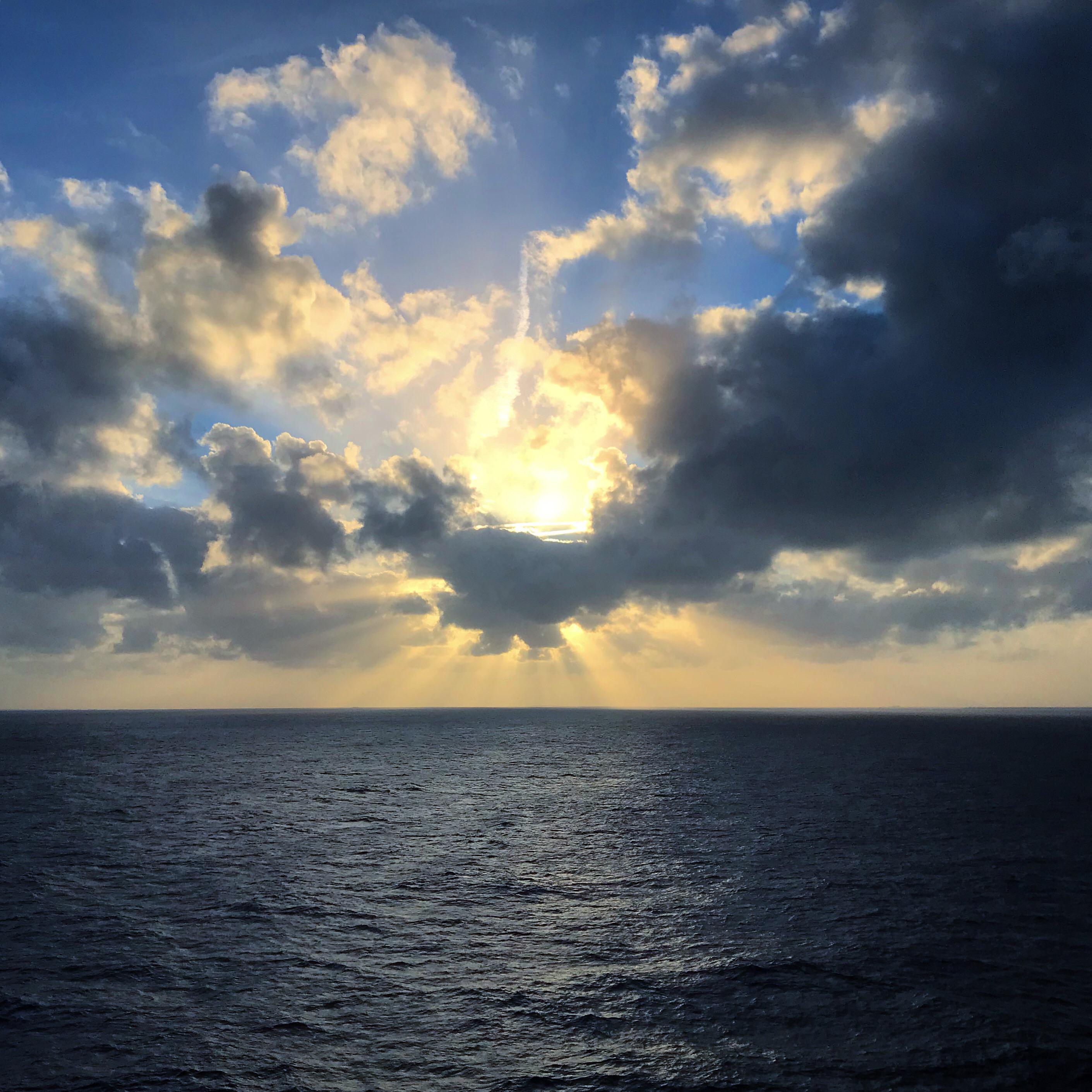 The sun behind a weird cloud. | Scrolller