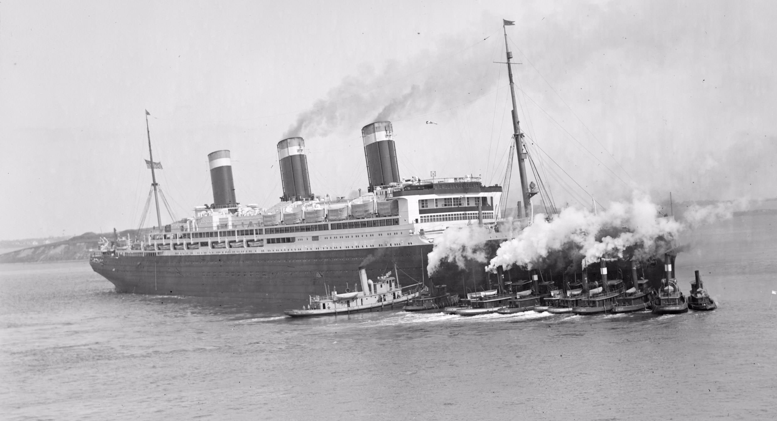 The USS Leviathan, here seen playfully being nudged by smaller vessels | Scrolller