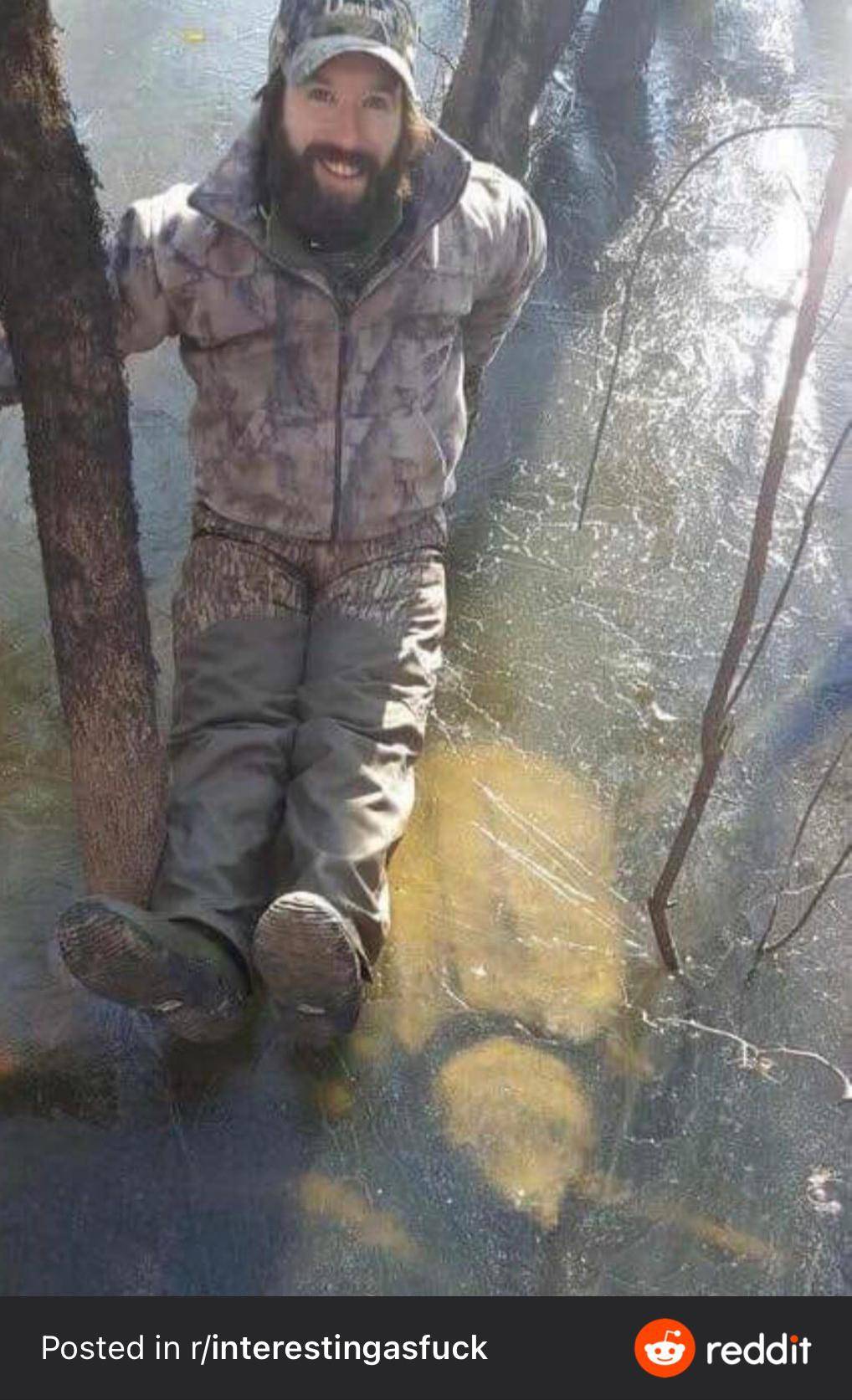 This giant snapping turtle hibernating beneath the ice is oddly terrifying! | Scrolller