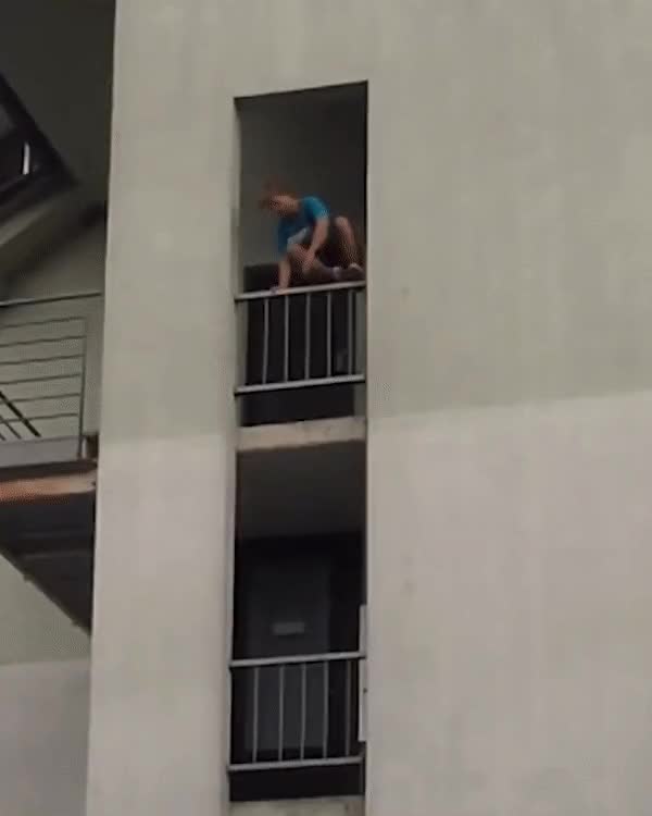 This guy casually scaling down three stories of his apartment building... | Scrolller