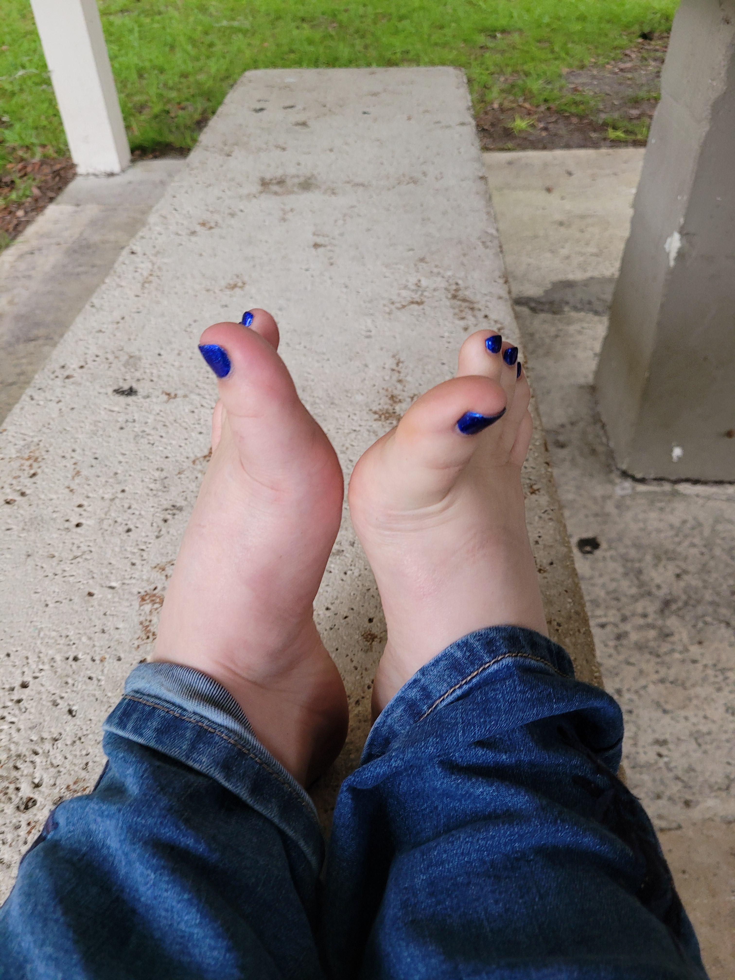 Toes and soles in a public park... | Scrolller