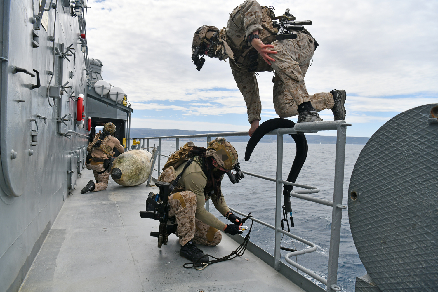 U.S. Navy SEALs board a Croatian Navy vessel in the Adriatic Sea, during training with Croatian ...