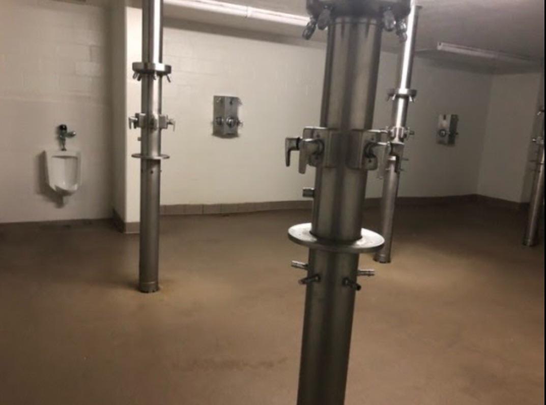 Urinal located by communal shower | Scrolller