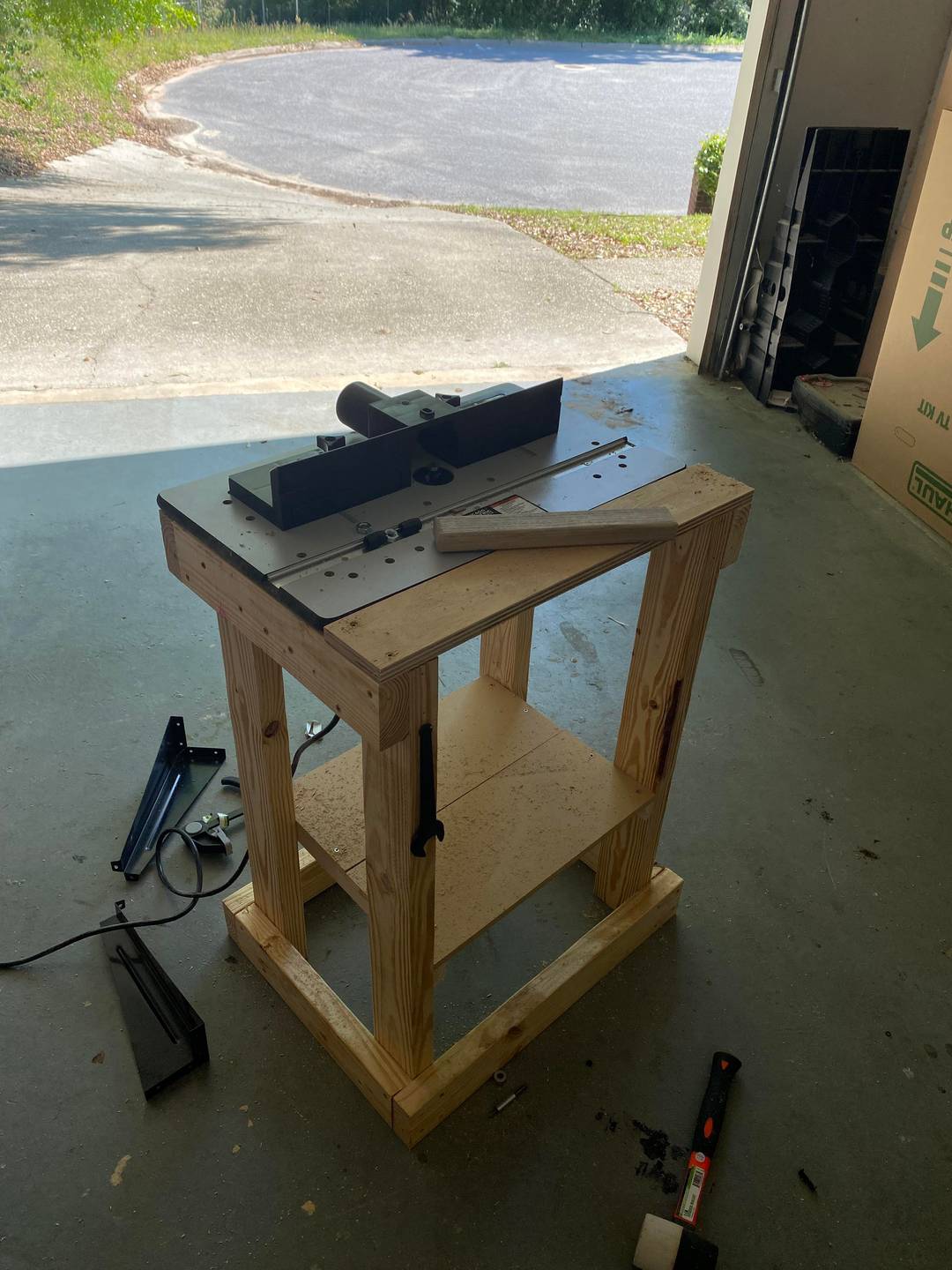 Used leftover scrap wood and took the legs off my cheap harbor freight ...