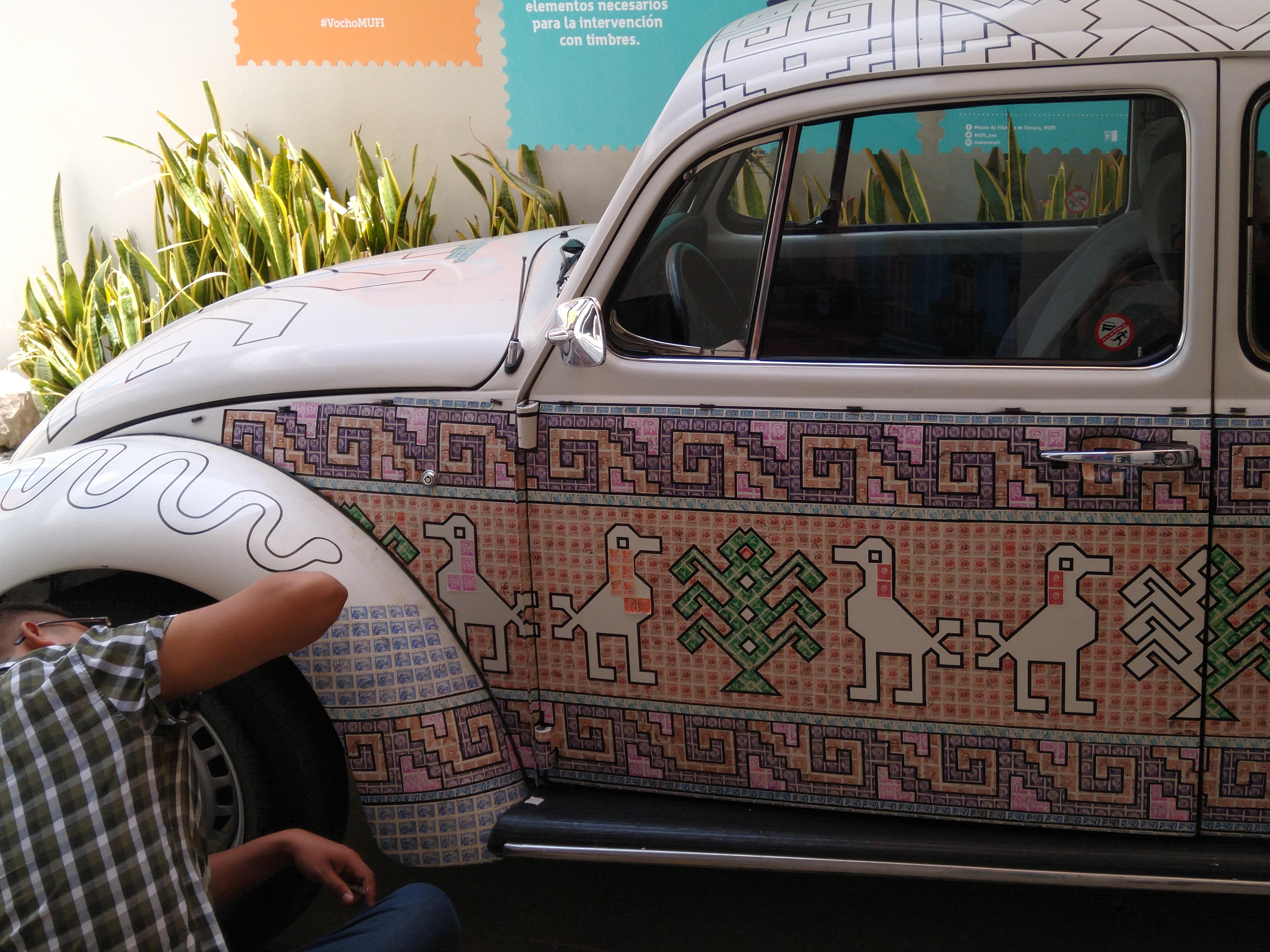 VW Beetle in the process of being covered with stamps. Museum of Philately or Oaxaca, Mexico ...