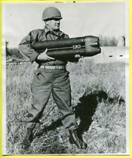 What appears to be a double-barreled flamethrower or rocket launcher? | Scrolller