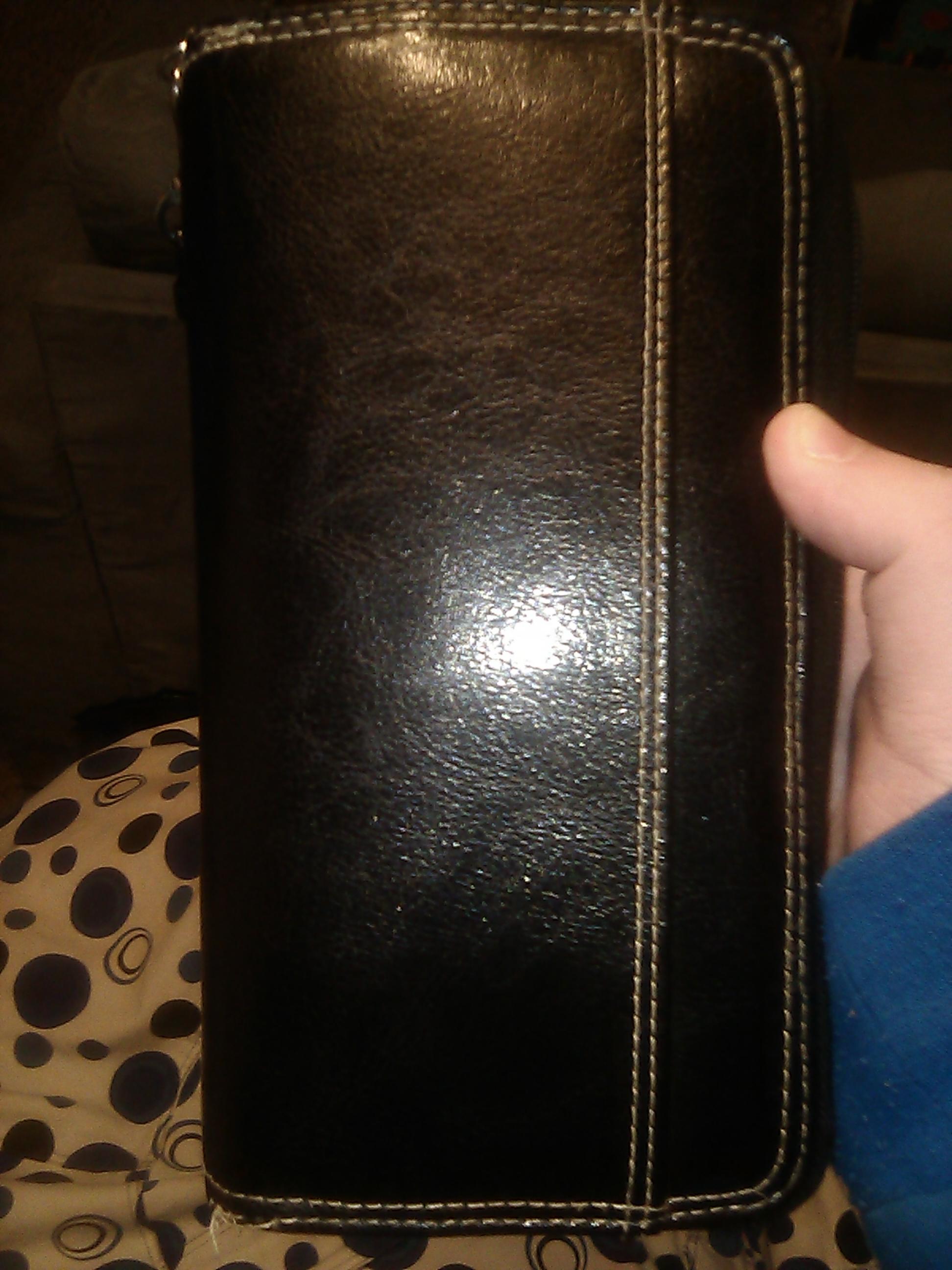 What color is this wallet black or brown | Scrolller