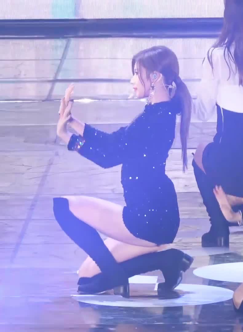 Sana - ponytail, black knee-high boots, short dress | Scrolller