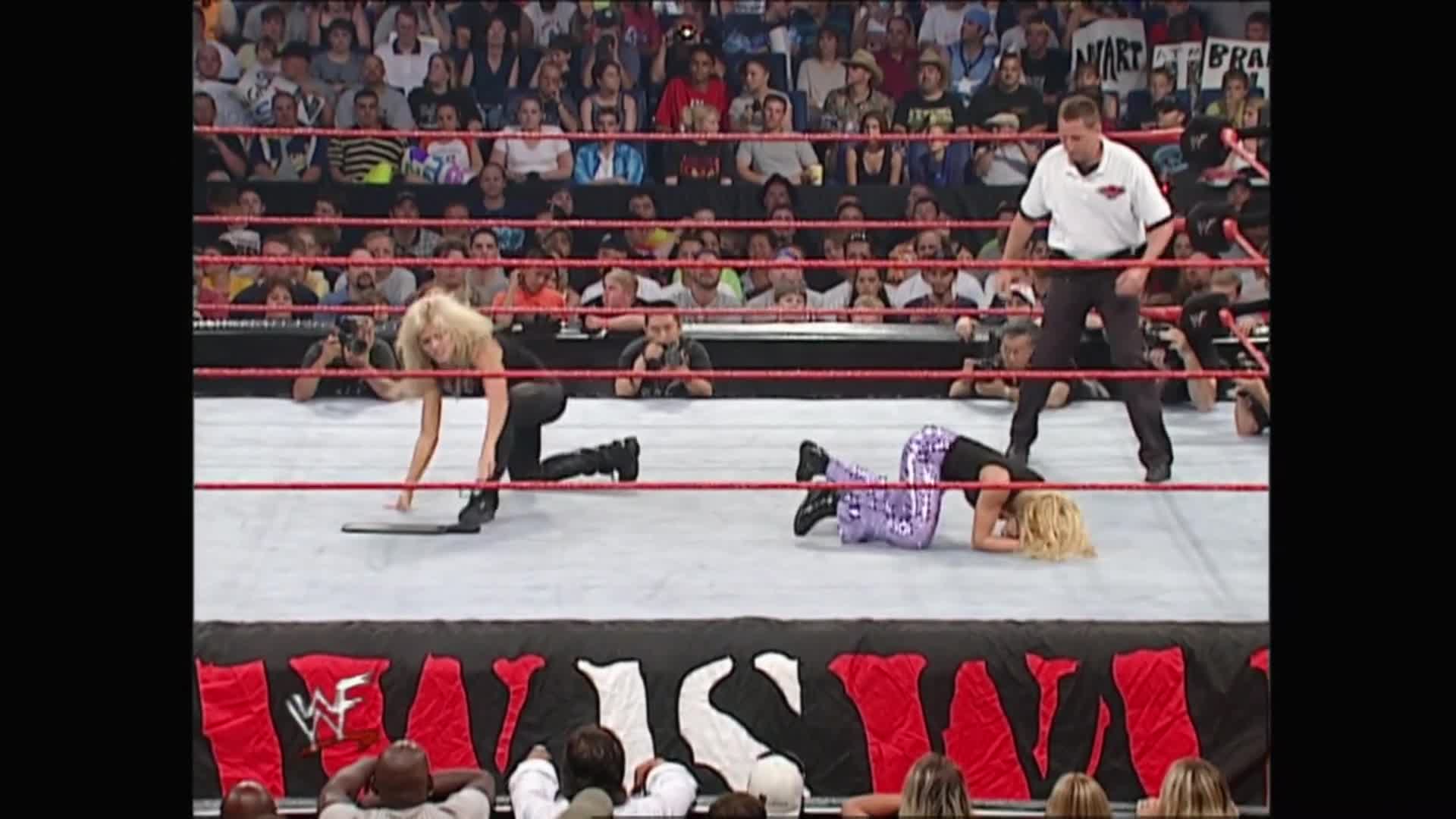 Trish Stratus getting paddled by Torrie Wilson | Scrolller