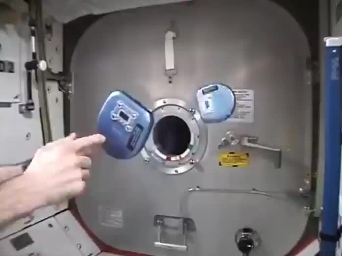 An astronaut demonstrating the difference between a CD player turned off and one that's turned ...