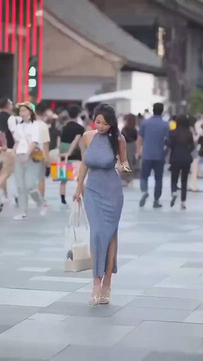 Busty beauty walking in the street | Scrolller