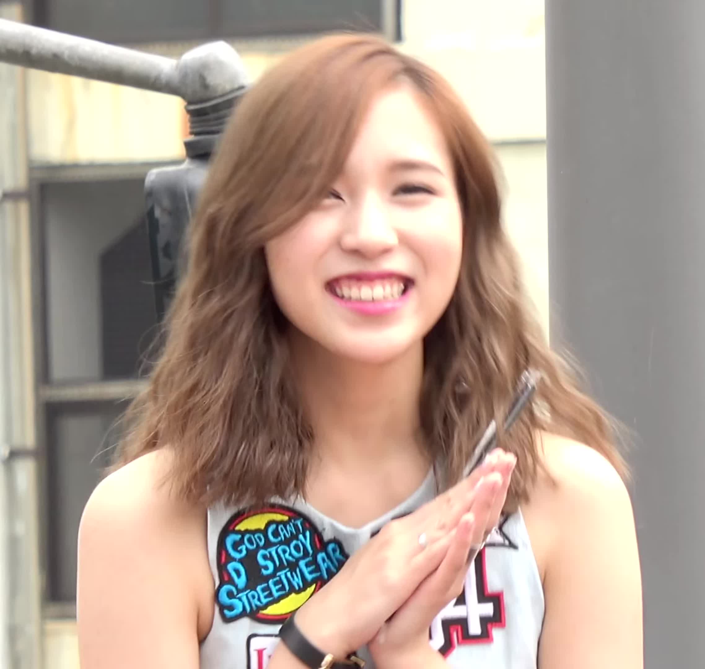 Mina - white top, close up | Scrolller