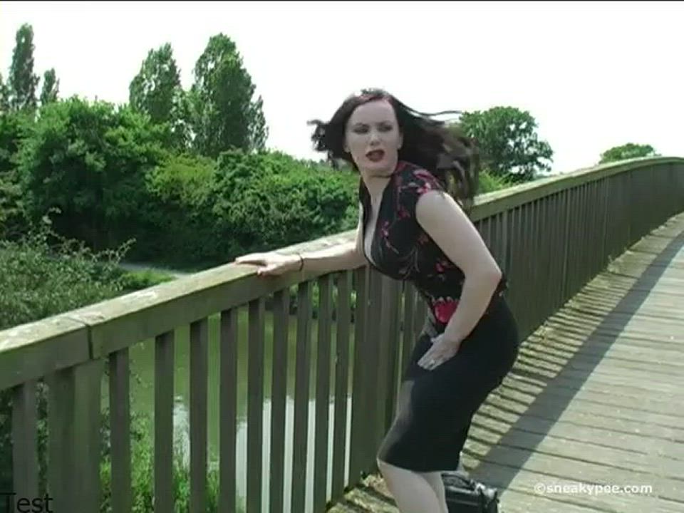 Raven-haired girl pissing on the bridge | Scrolller
