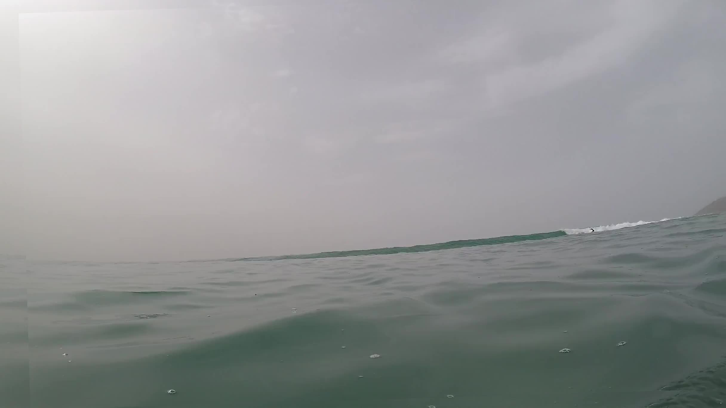 Surfer on wave | Scrolller