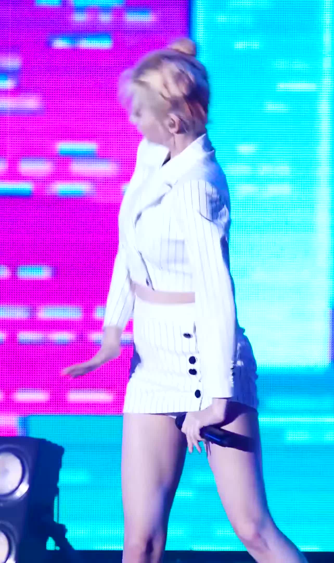 Sana - blonde hair buns, white striped shorts, suit jacket | Scrolller