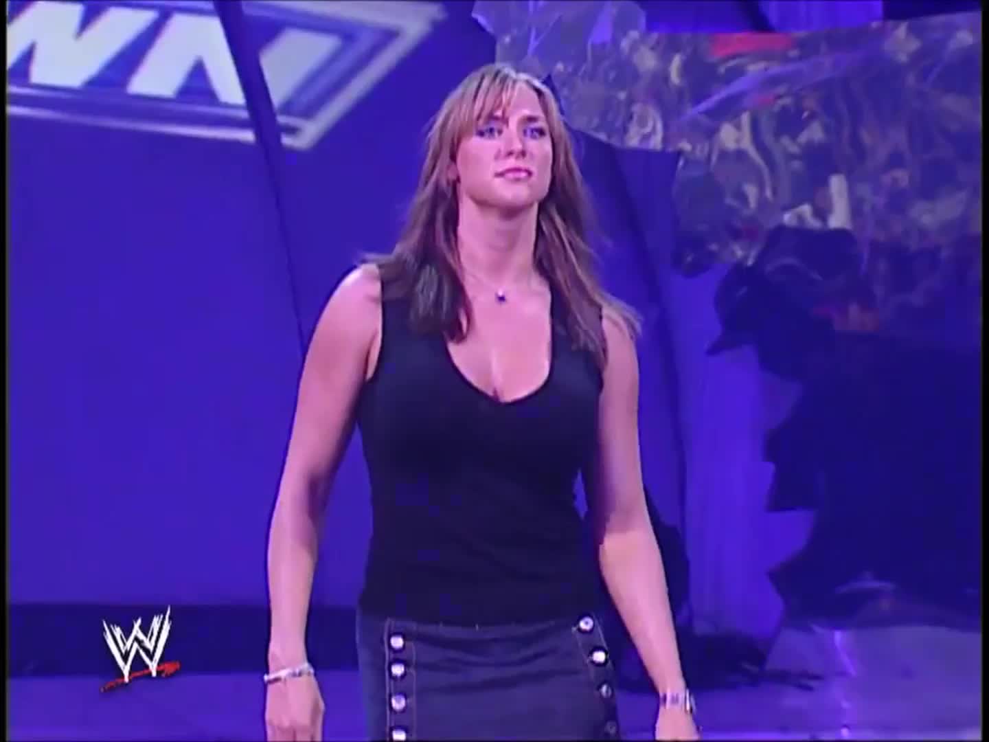 Stephanie McMahon doing her entrance strut as her breasts jiggle | Scrolller