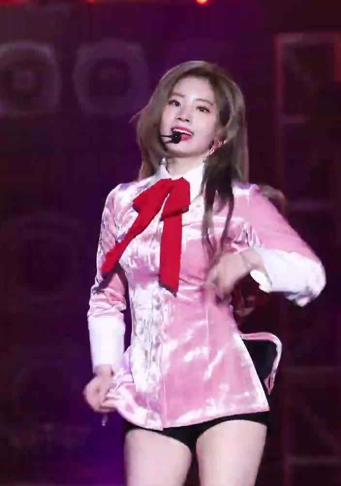 Dahyun - black shorts, pink top, red bow | Scrolller