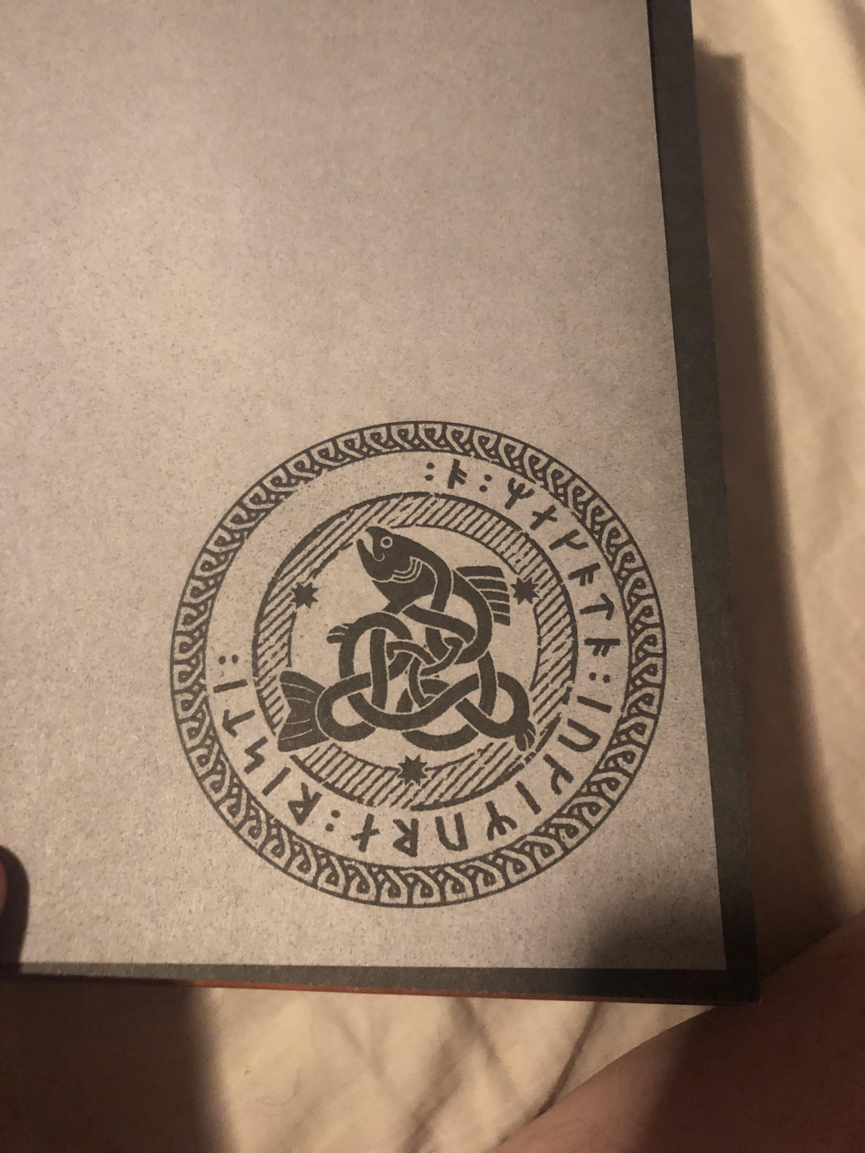 Anyone know the meaning of this symbol and or what the runes say on it ...