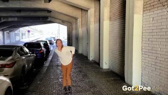 Dirty European blonde relieves her piss desperation onto the pavement | Scrolller