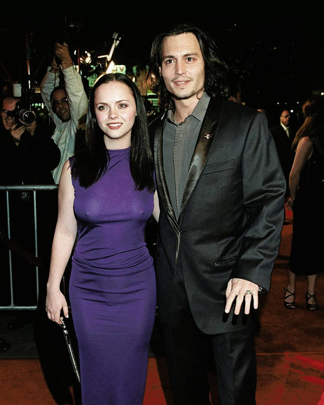 Johnny Depp with Christina Ricci at the Sleepy Hollow movie premiere (Hollywood, 1999) | Scrolller