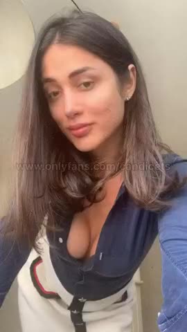 Sensually pulling up her skirt to reveal her thick cock | Scrolller