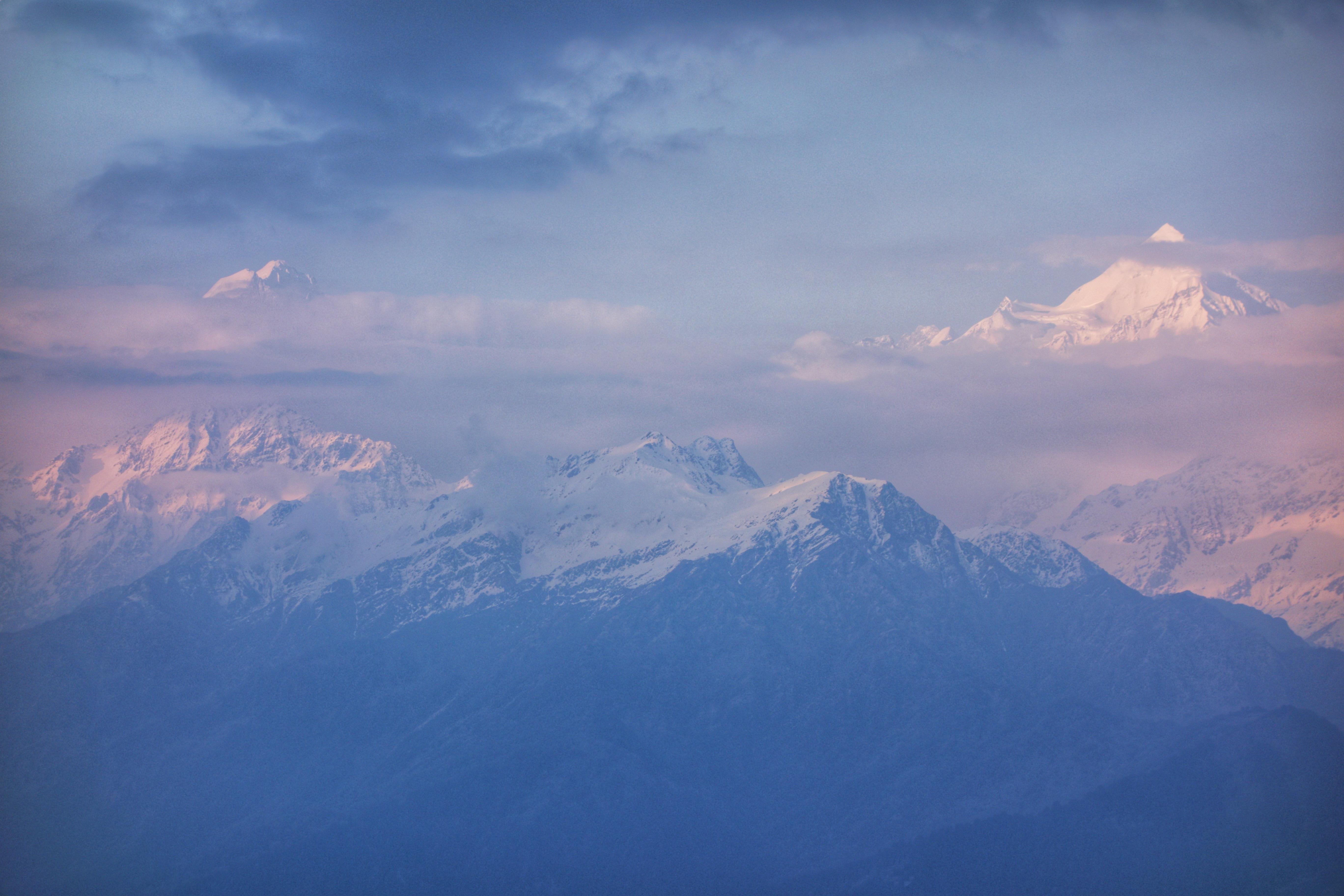 Thick mist/clouds cleared for a bit and the Himalayas glistened in the last light of Sun ...