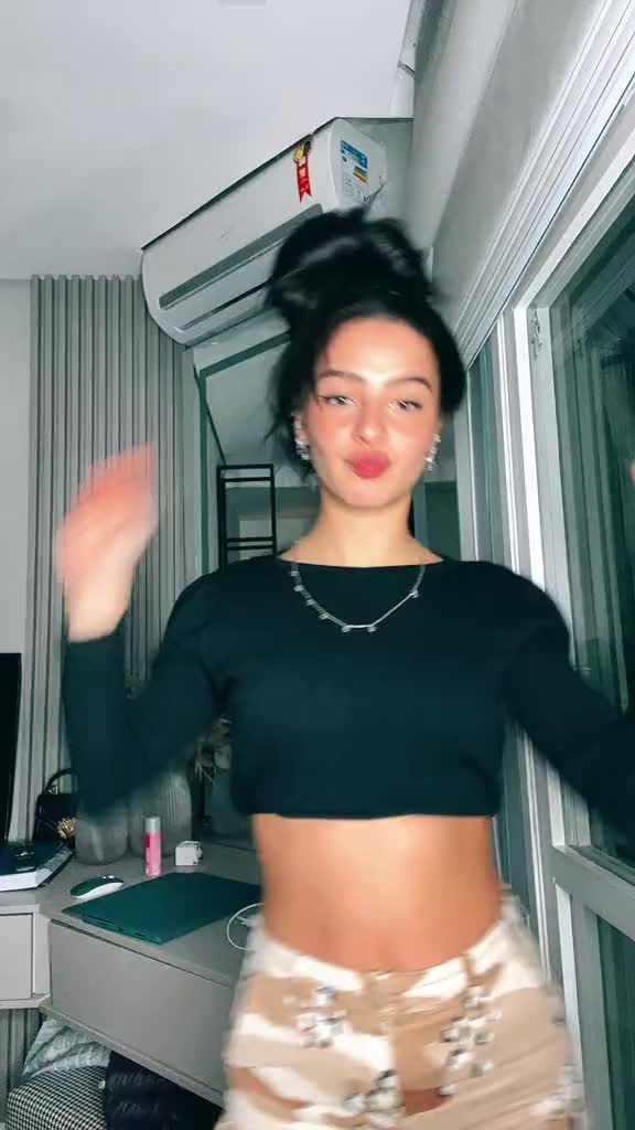 TikTok in black top | Scrolller