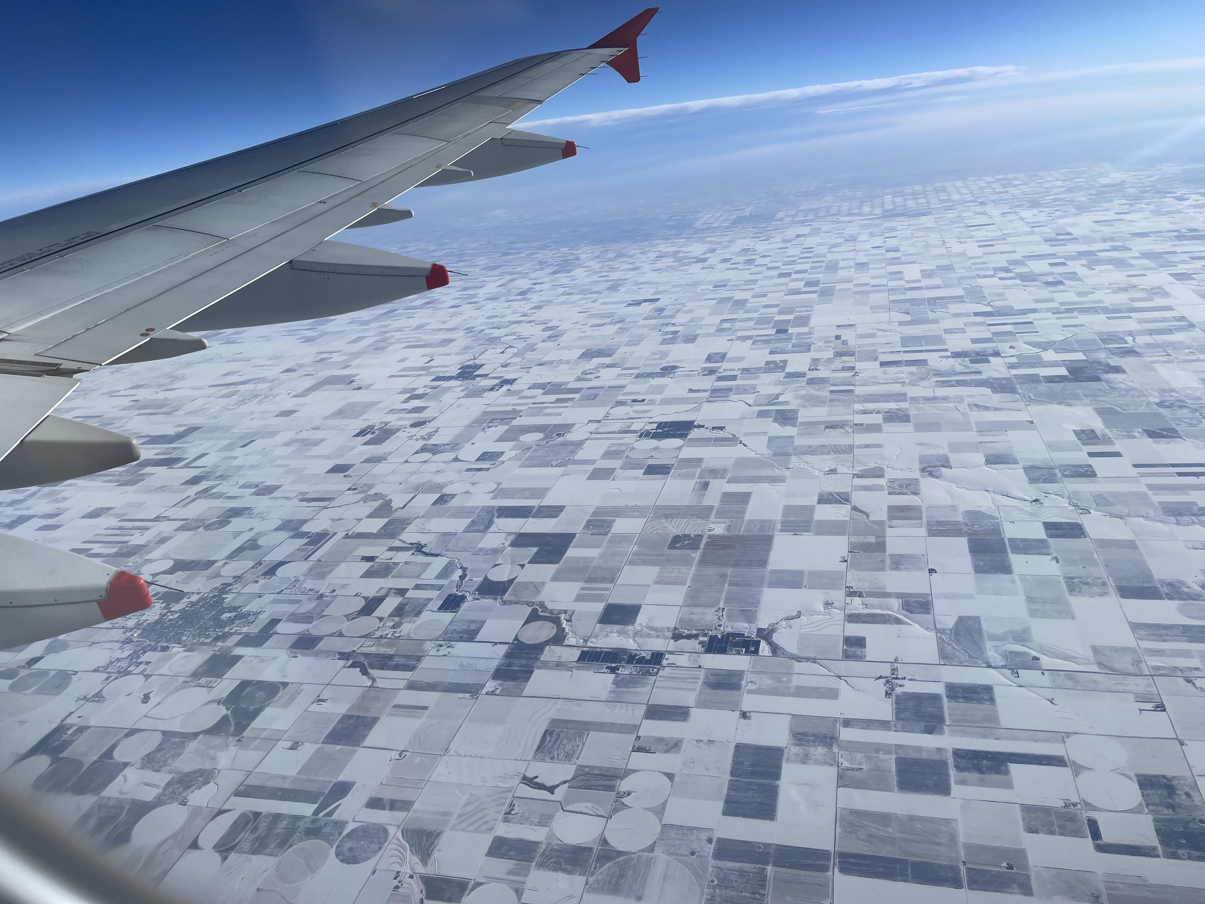 What are those circles and how are they forming? Took this while flying over Colorado and was ...