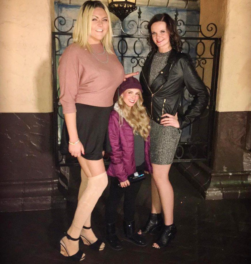 6'9" Lindsay Hayward and 6'4" Krista Kay with tiny Lissy. | Scrolller
