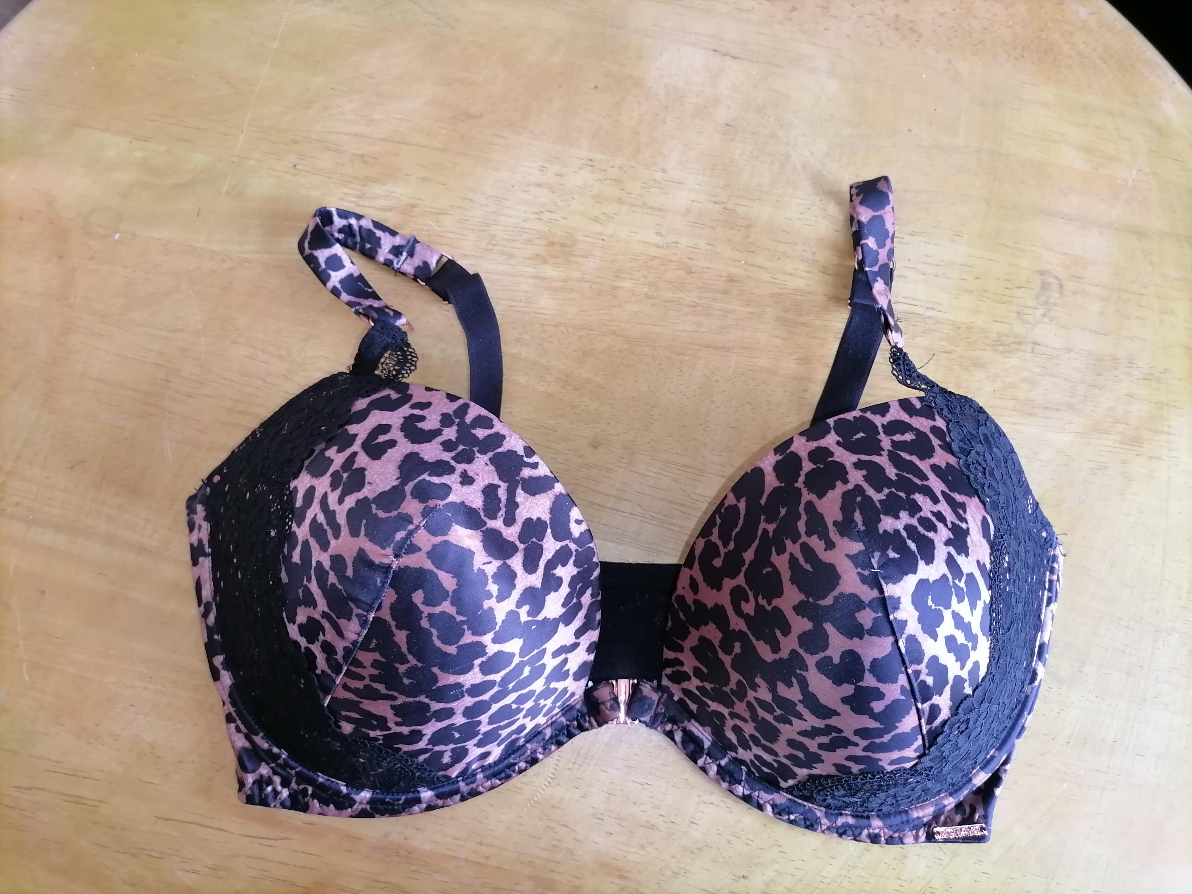 A 38F satin leopard print padded bra with a sleek front clasp. It was a joy to watch the ...