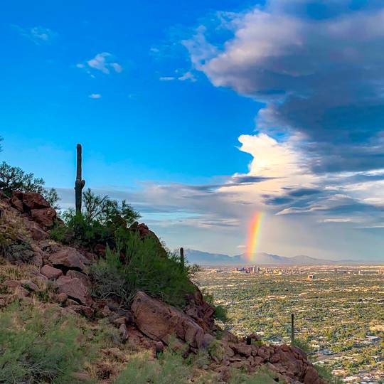 A rainbow seen right over downtown, from Camelback Mountain this morning | Scrolller