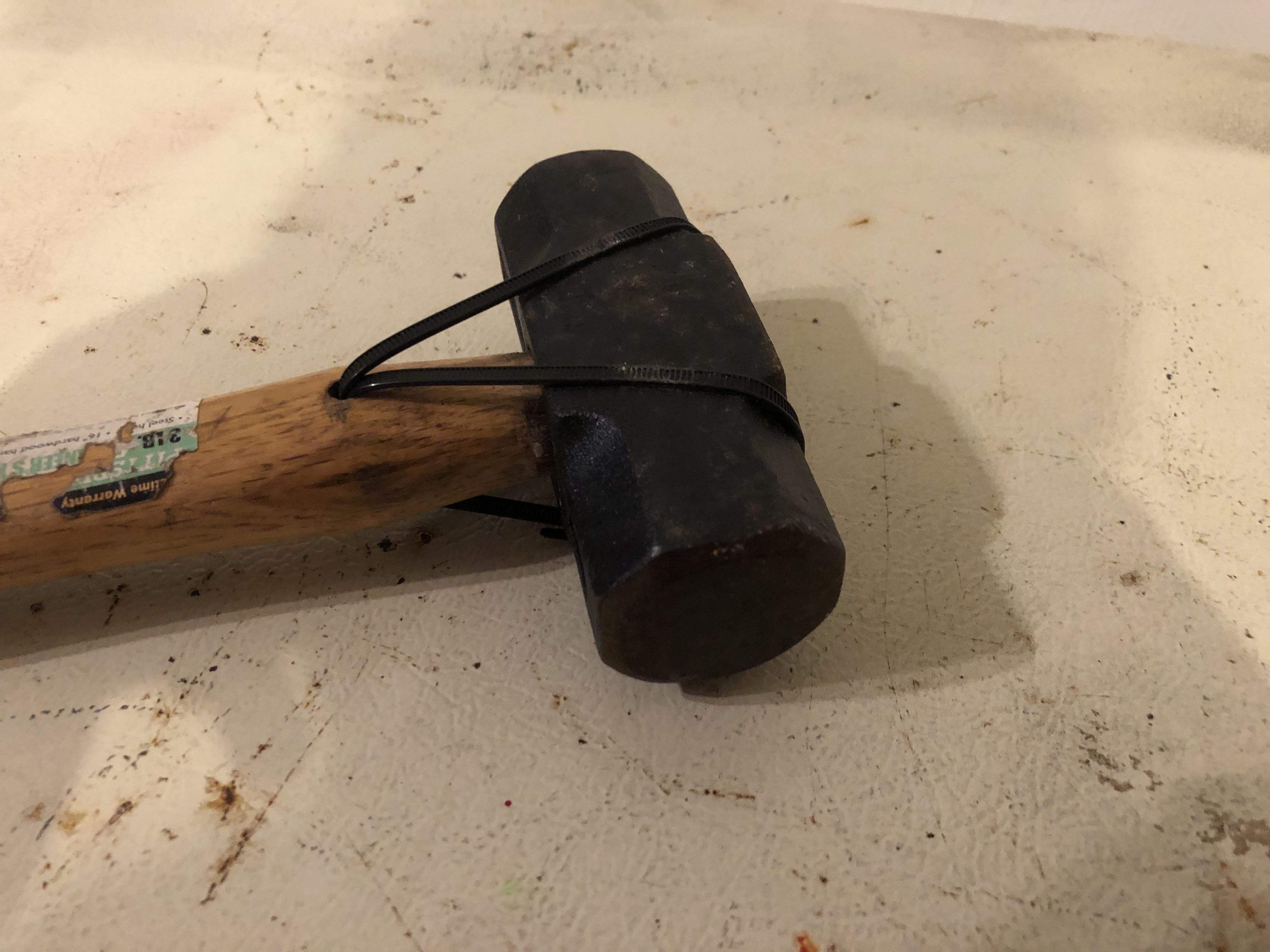 A year later and my “temporary fix” is still going strong and holding my hammer together ...