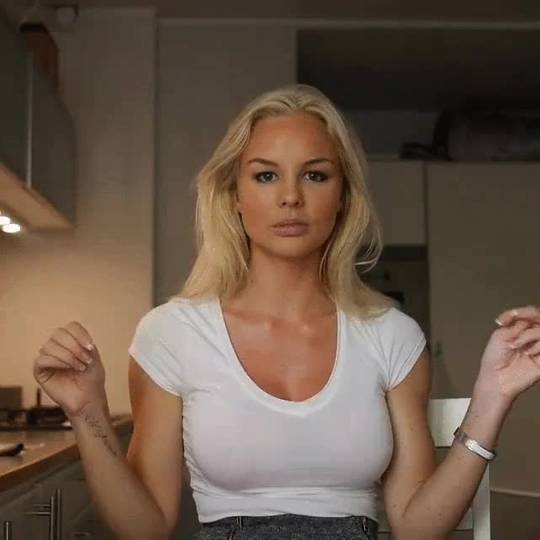 Alexandra Bring points downward | Scrolller