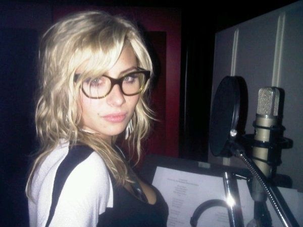 Aly in the recording studio. | Scrolller