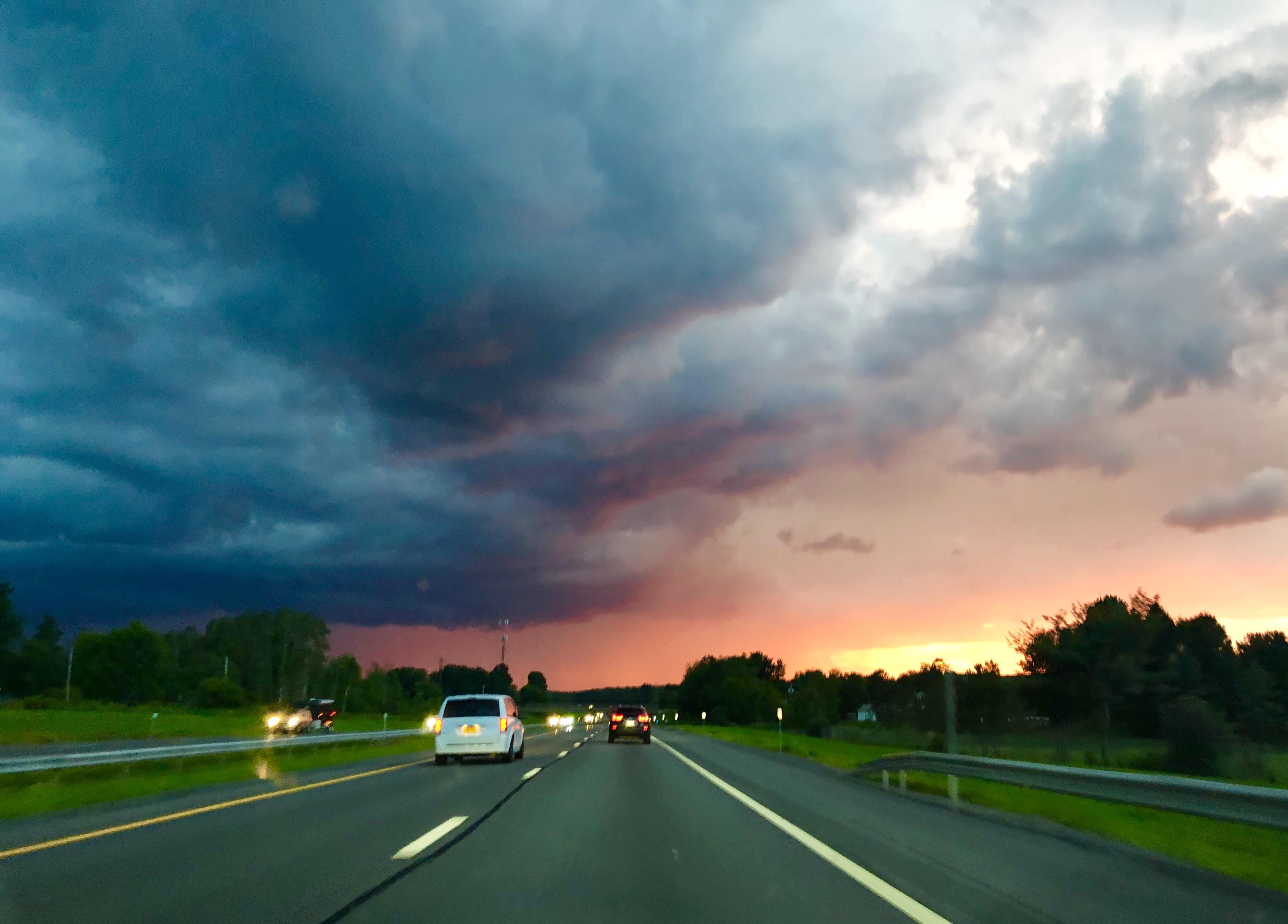 An ominous path forward - thunderstorm rolling over the Thruway at sunset | Scrolller