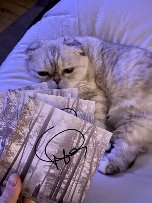 Another snap of Olivia and the booklets! | Scrolller