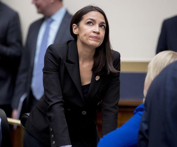 AOC bending over a table thinking “alright go ahead and get it over with and fuck me” | Scrolller