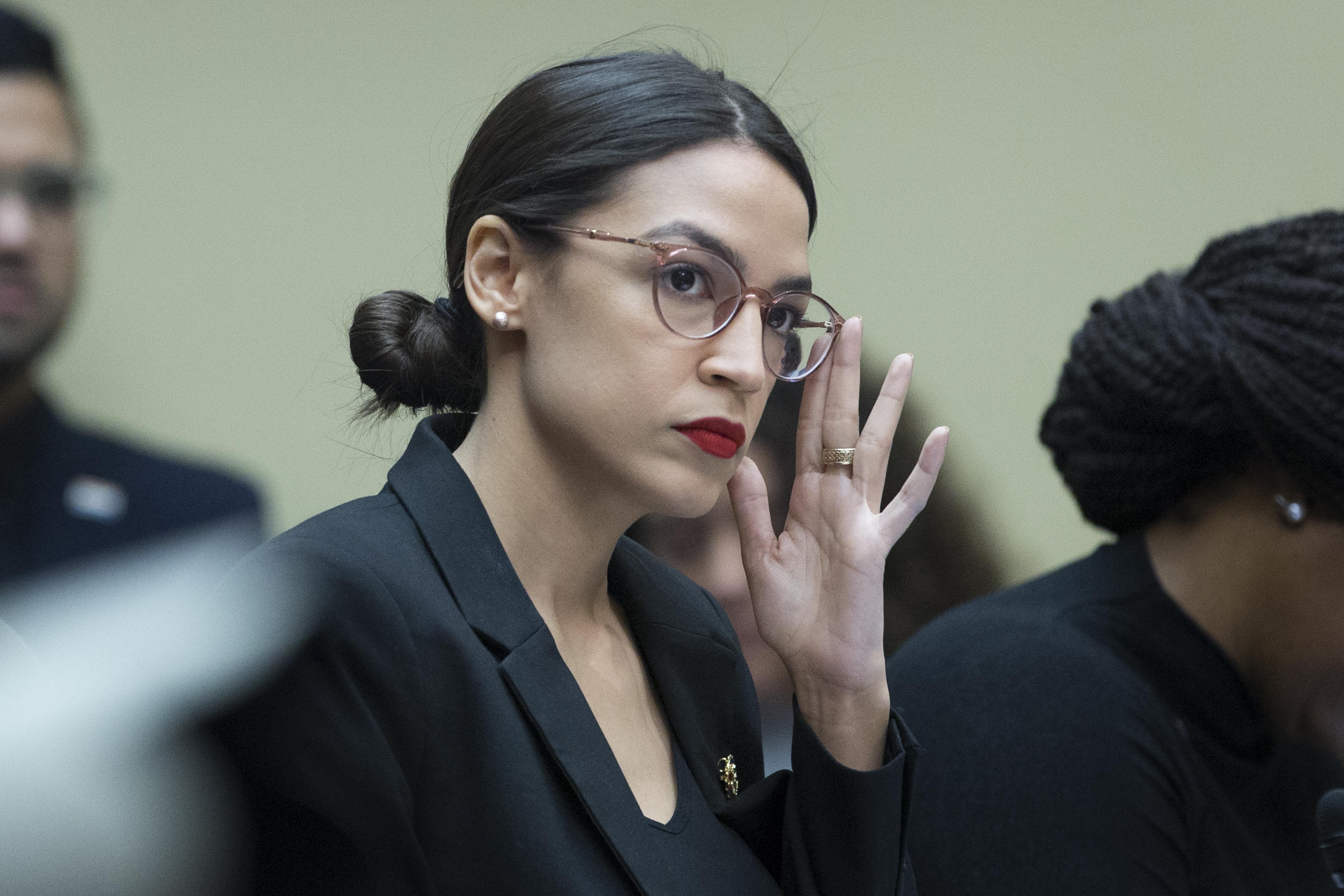 AOC looking like a superhero's mild-mannered alter ego