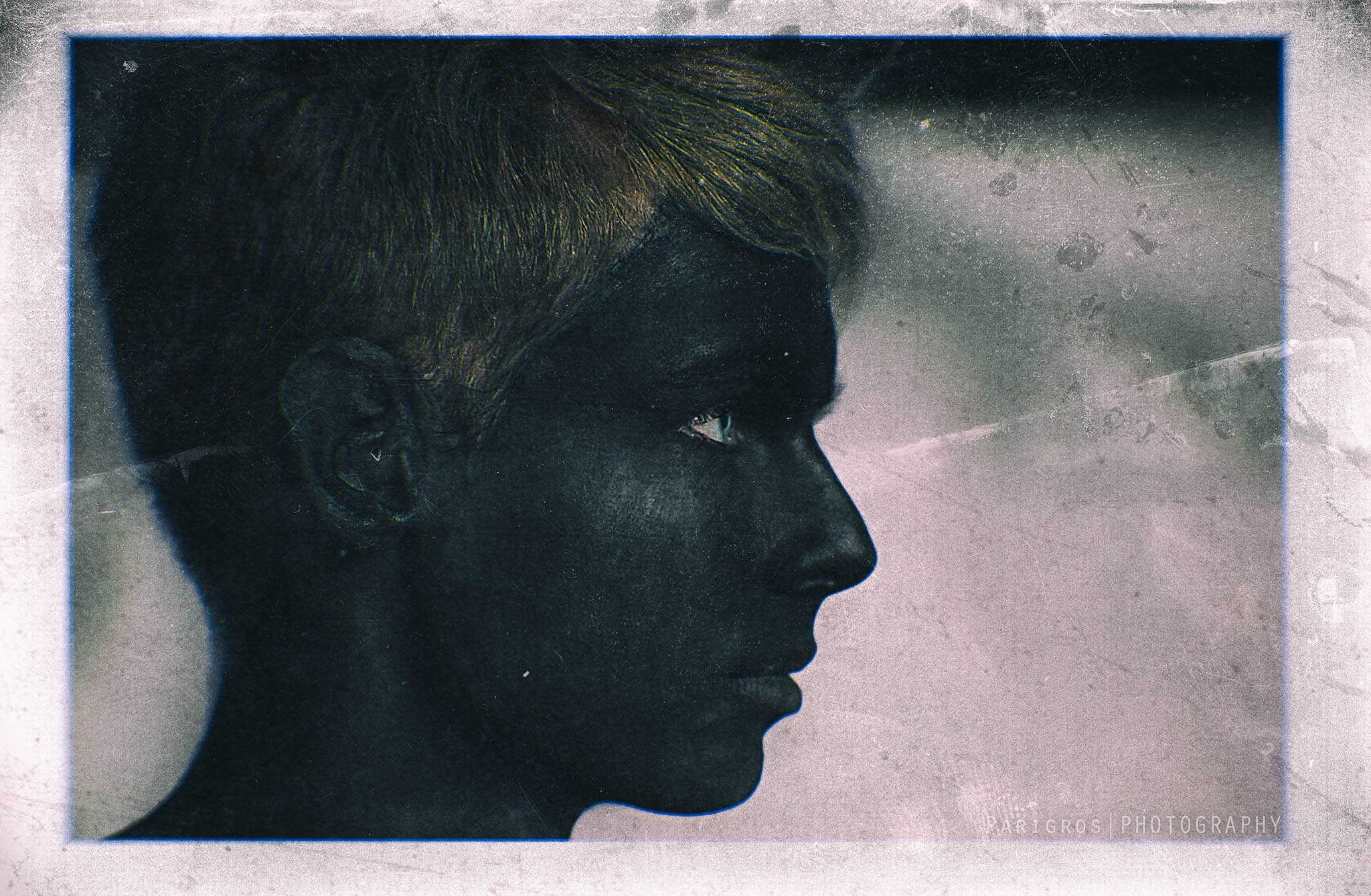 Black Facepaint Boy with Golden Hair | Scrolller