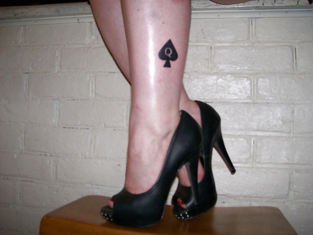 Black heels and a black QoS tattoo | Scrolller