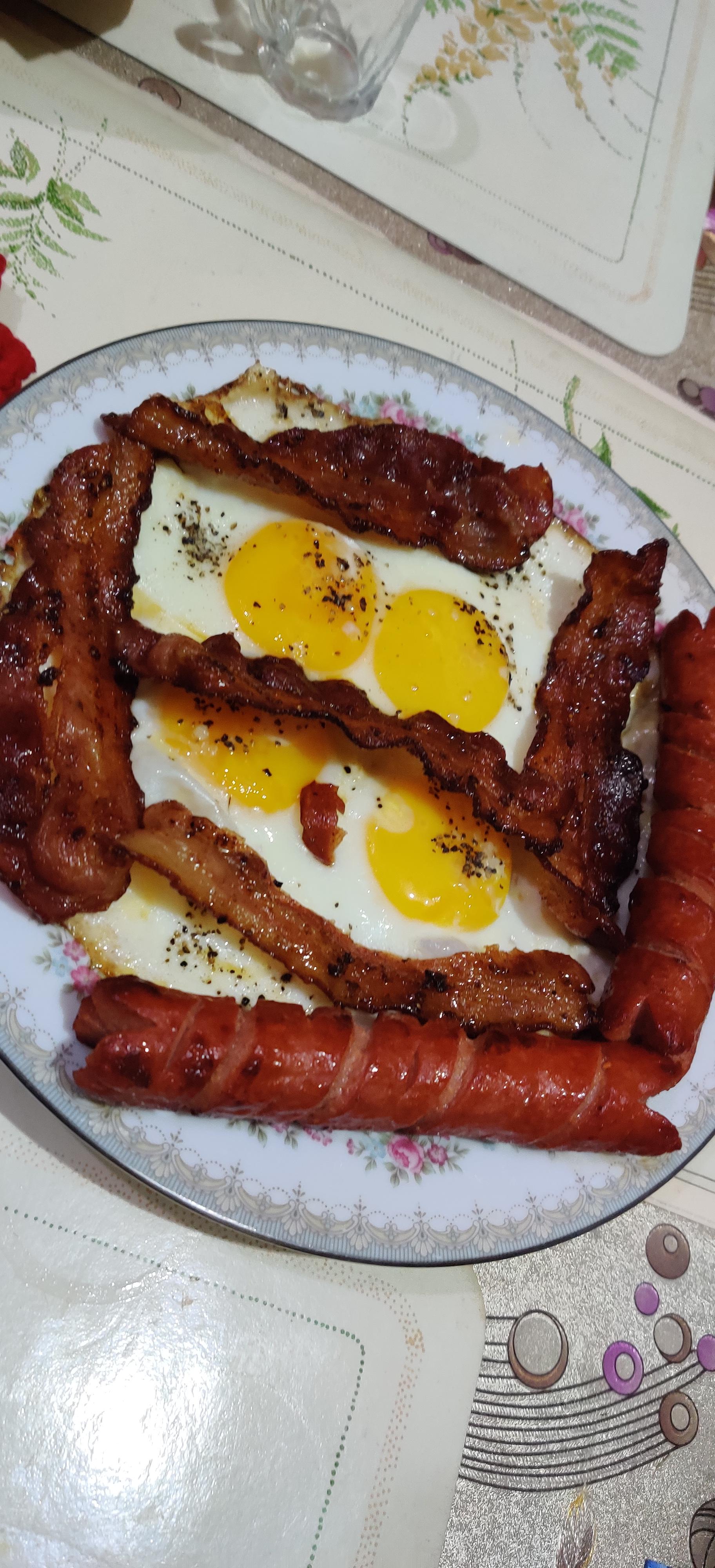 Breakfast! Sunny Side Ups Topped with Glazed Bacon and German Franks. | Scrolller