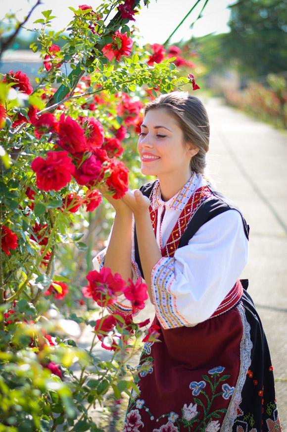 Bulgarian woman in traditional dress at Rose Festival | Scrolller