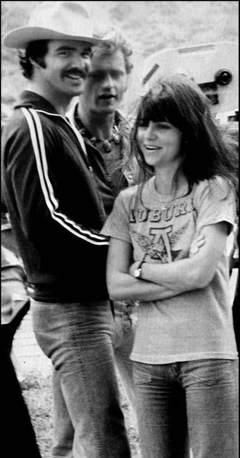 Burt Reynolds, Jerry Reed, and Sally Field on the set of Smokey and the Bandit in 1976 | Scrolller