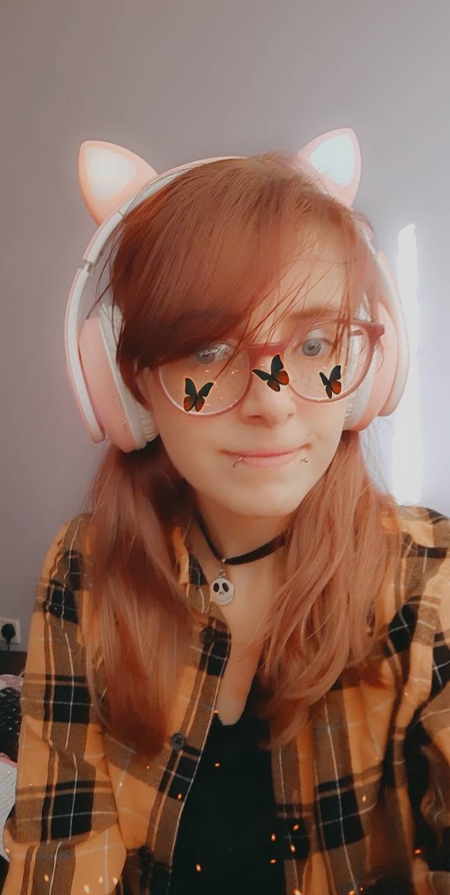 Cat headphones and butterfly freckles | Scrolller