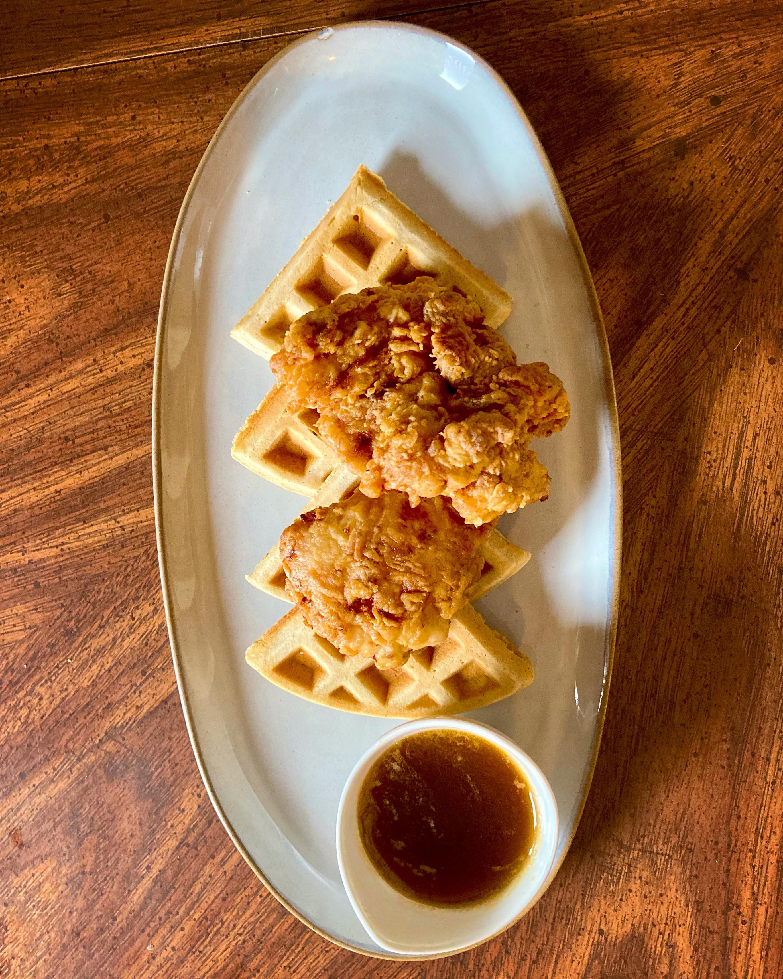 Chicken and waffles paired with a honey chili maple syrup | Scrolller