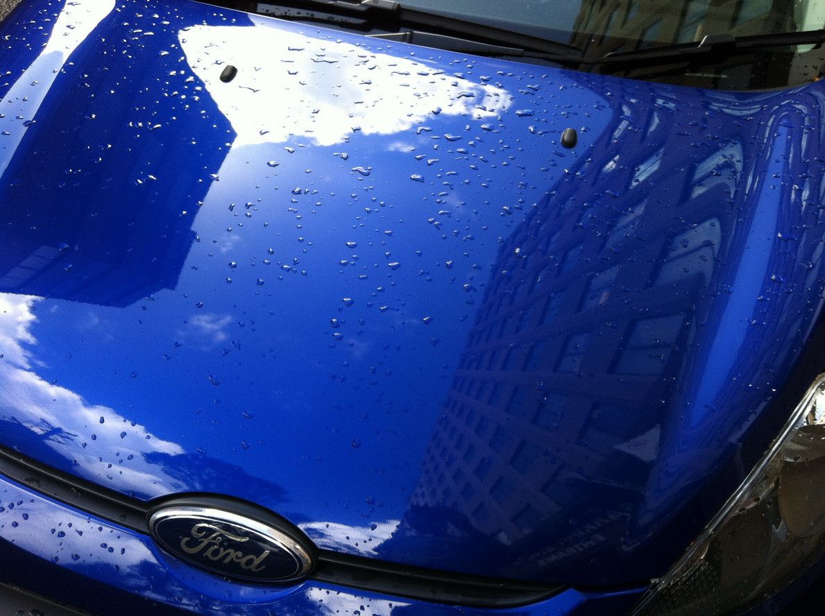 Clearing sky reflected in car bonnet | Scrolller