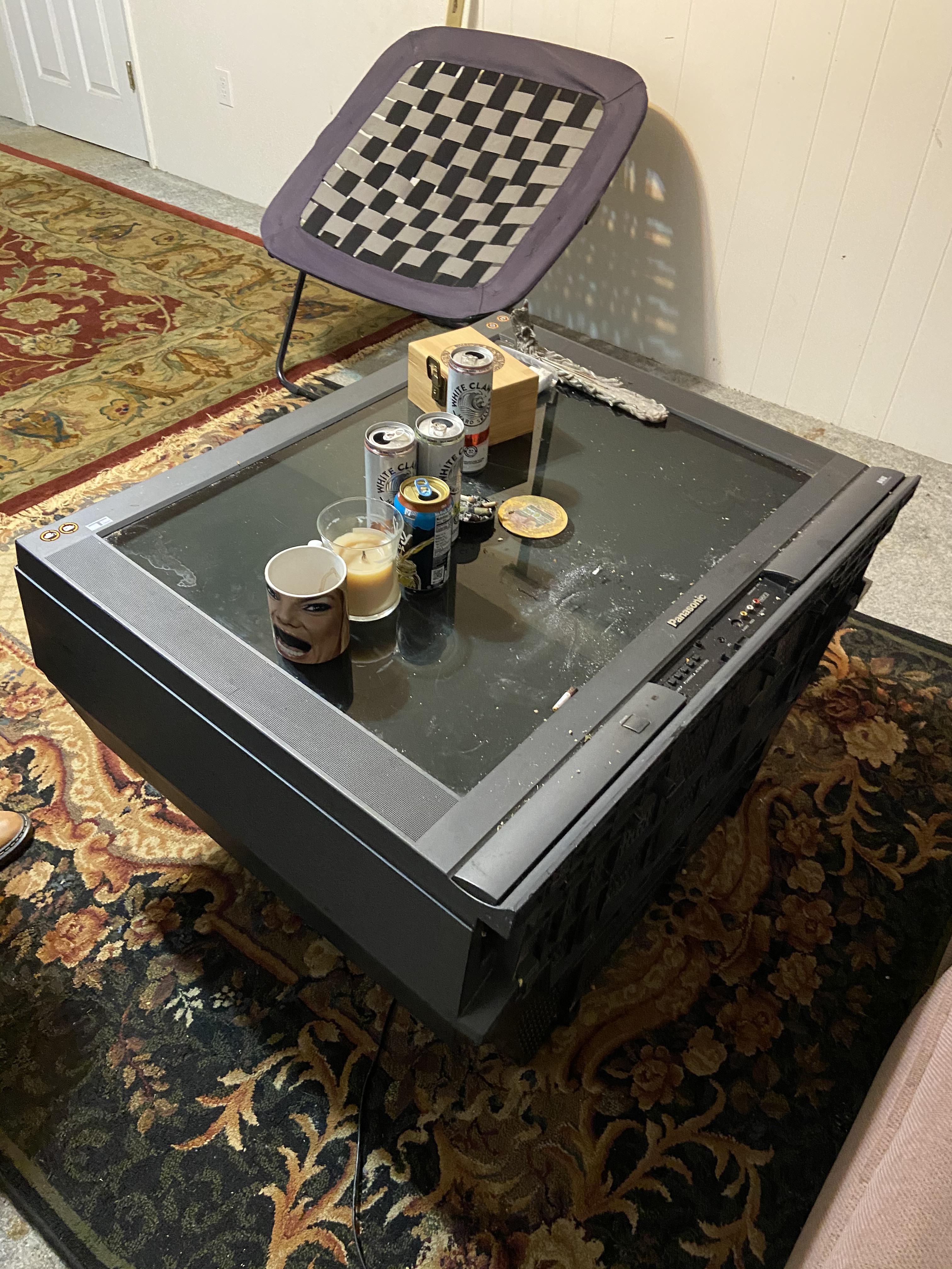 Coffee tables are for capitalist pigs. You are innovative. You recycle. You use a fat Panasonic ...